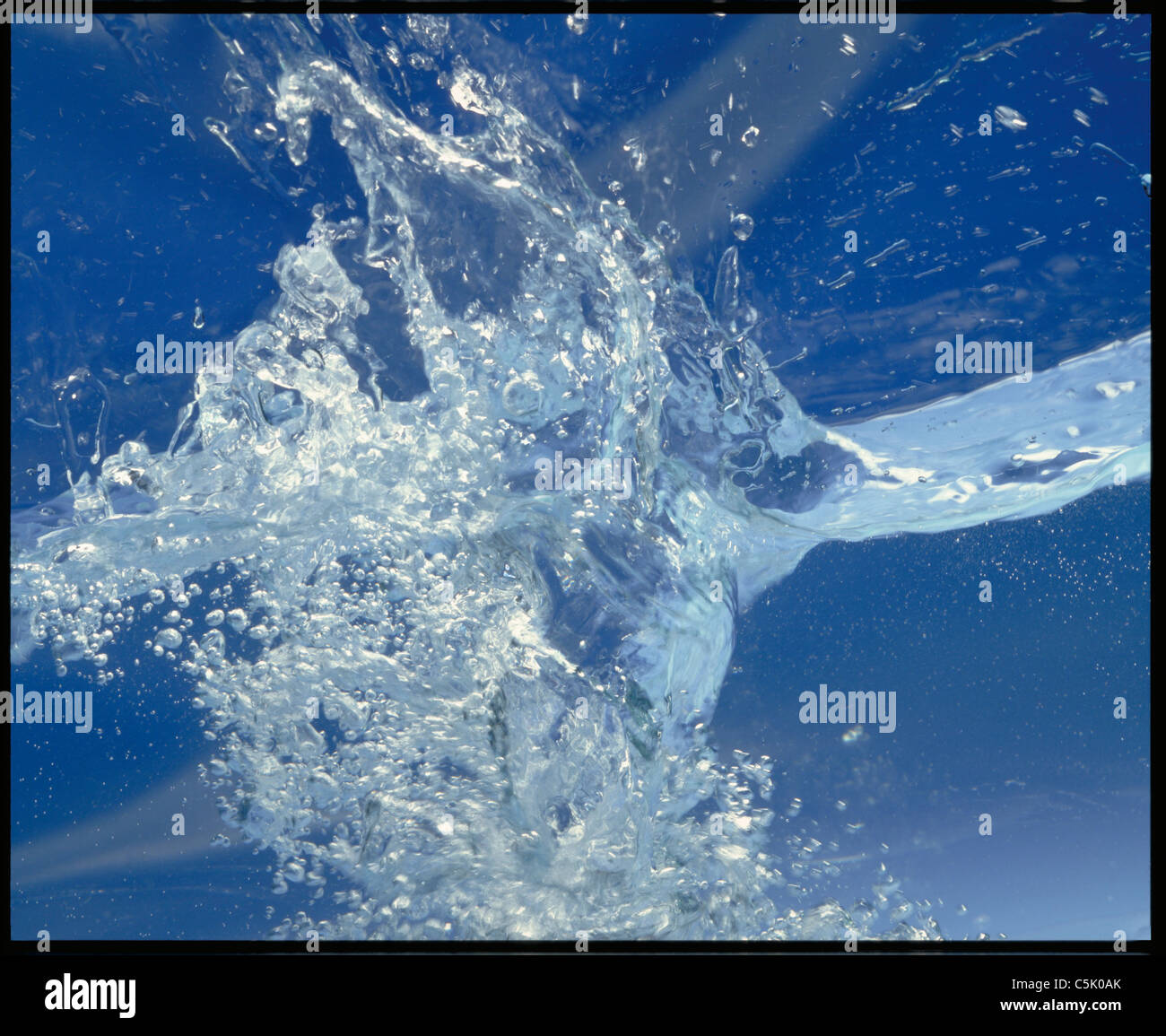 High speed capture of splashing water in studio. Large format camera ...