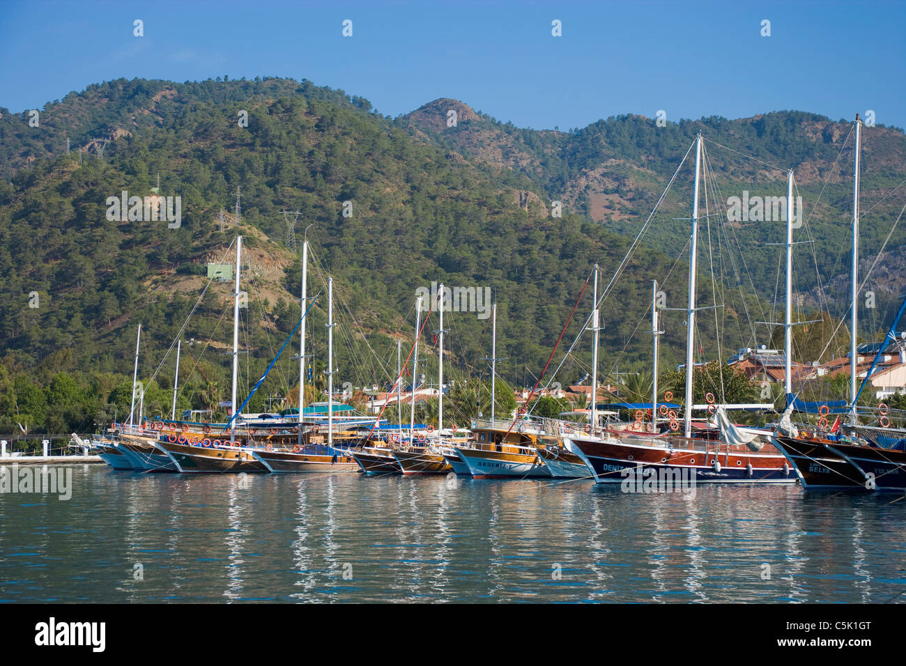 Turkish yachts Gulets on blue cruise moored in Gocek, Fethiye bay ...