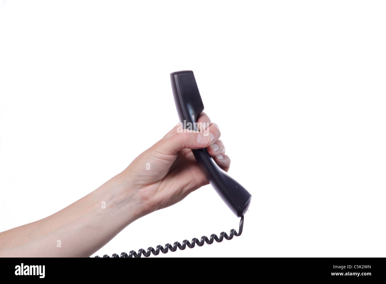 Hand with a telephone receiver Stock Photo - Alamy