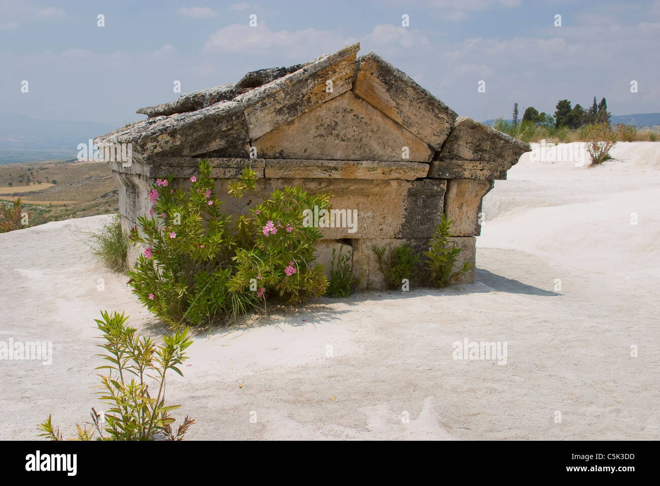 Sarcophagus embedded in white travertine rocks of Pamukkale (ancient ...