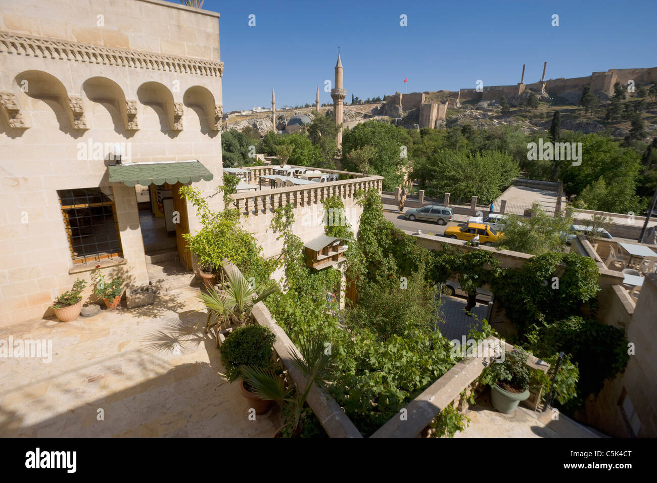 Minaret of Halil-ur Rahman Mosque with Urfa Castle at the background as ...