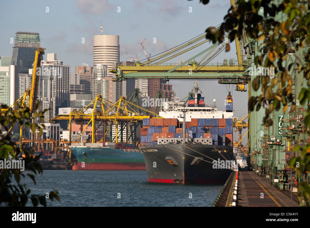 A container ship is loaded at the Brani Terminal in the port of ...