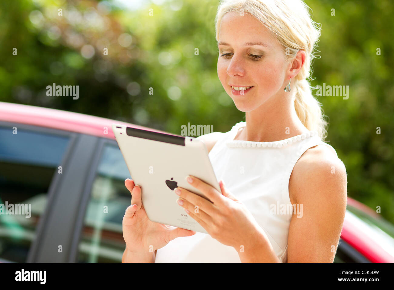 Business Woman with iPad Stock Photo - Alamy