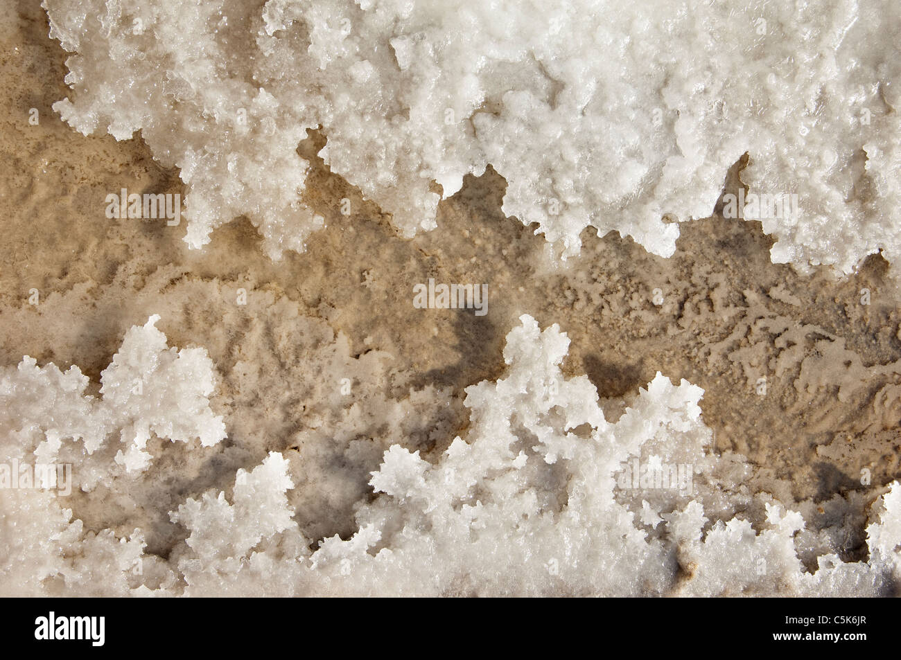 Crystallized salt in an evaporation pond, Algarve, Portugal Stock Photo ...