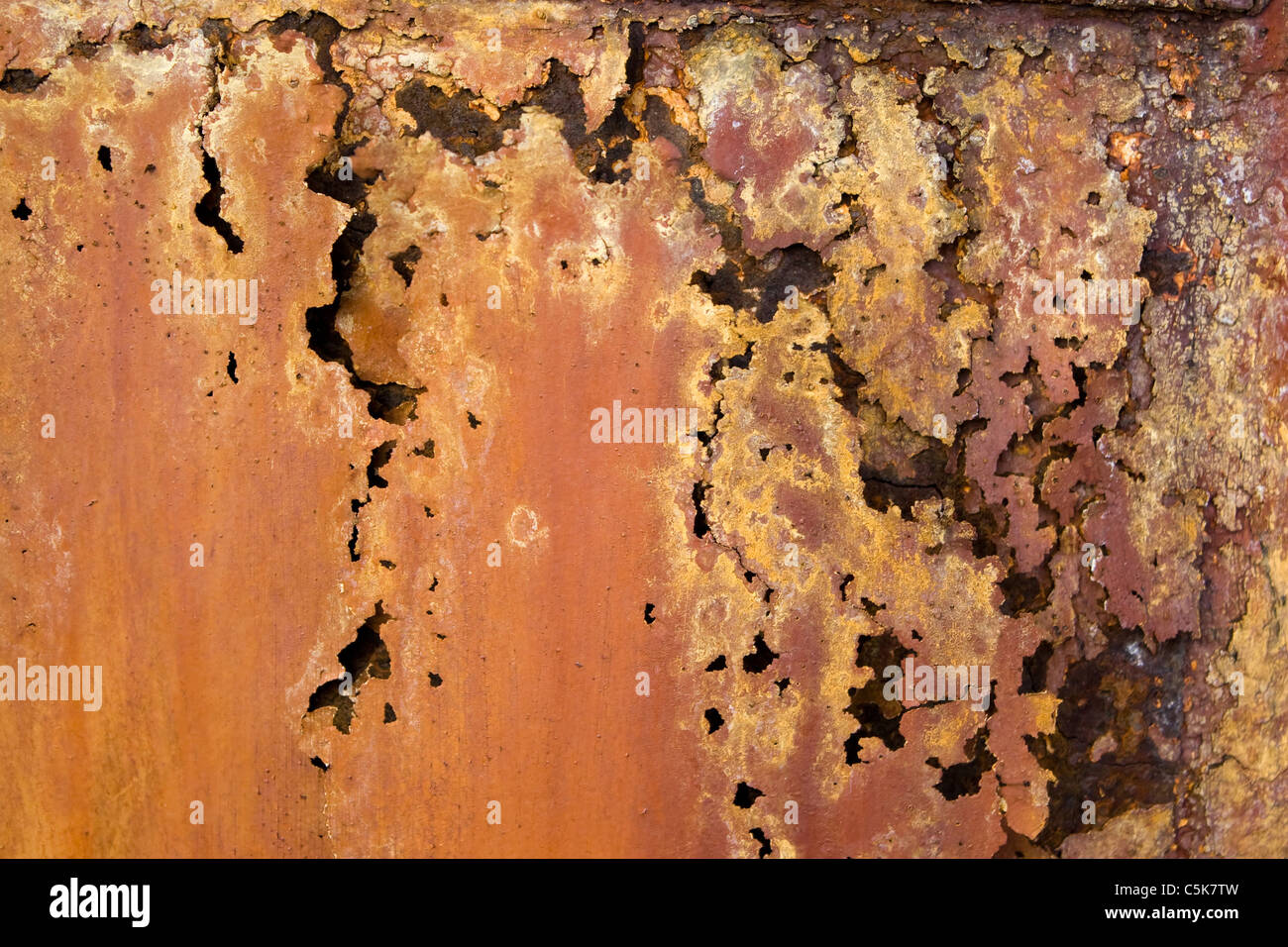 A rotted metal panel covered in rust Stock Photo - Alamy