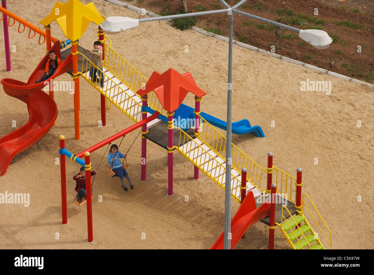 Aerial view of children at a playground, Buyukcekmece, Istanbul, Turkey ...