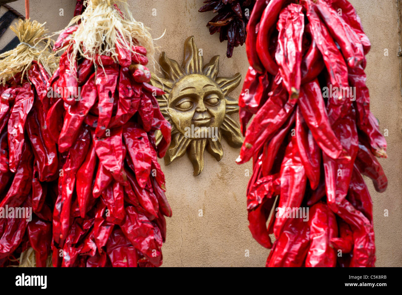 Red chili pepper ristras are displayed at a roadside market in Lincoln ...