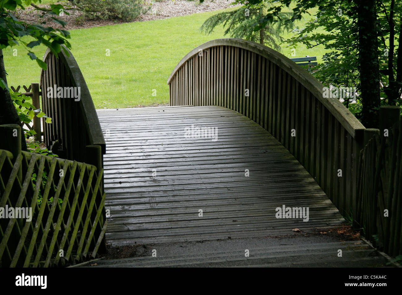 A wooden bridge in a park Stock Photo - Alamy