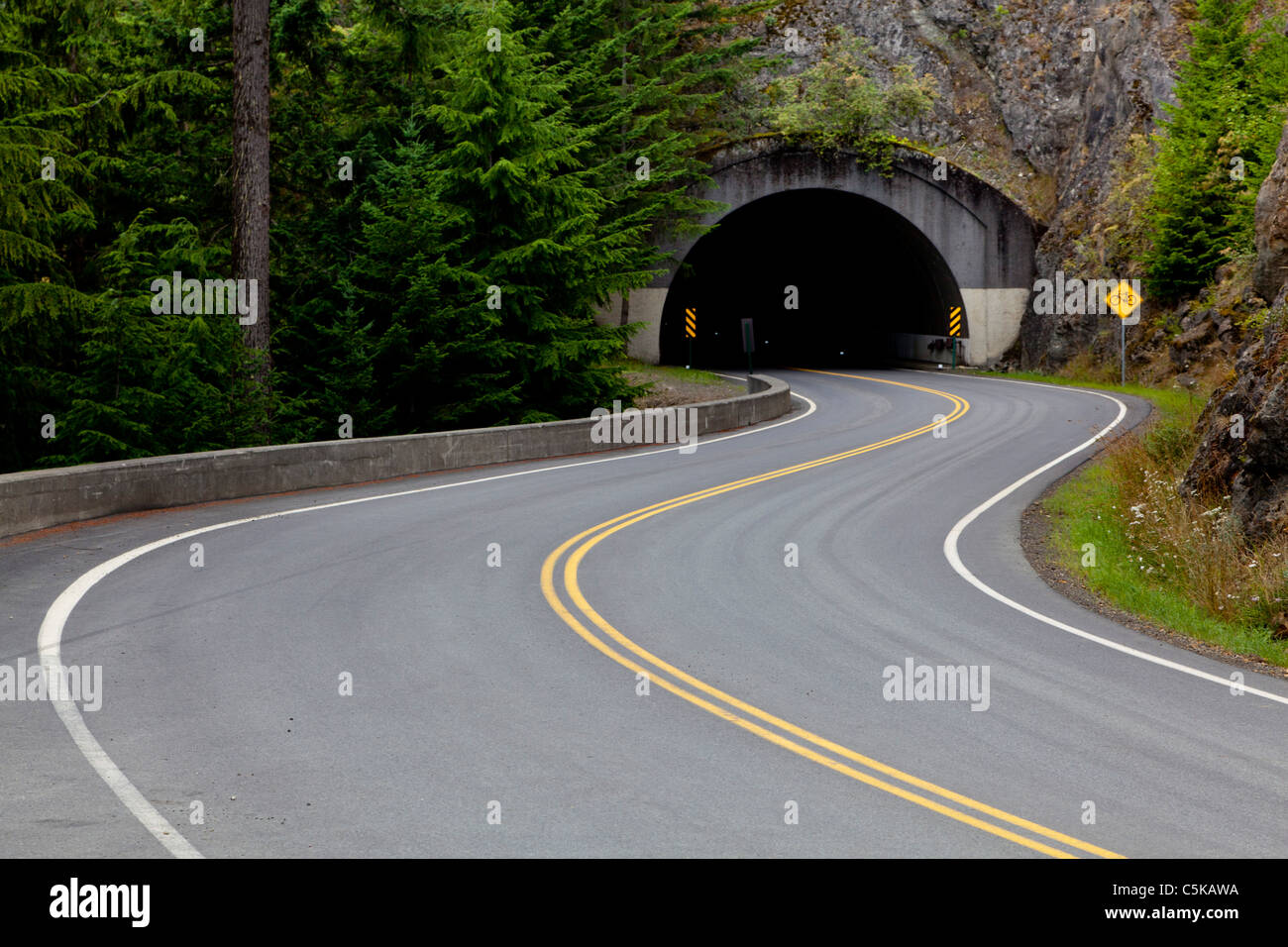 Bending road entering tunnel Hurricane Ridge Road Olympic National Park ...