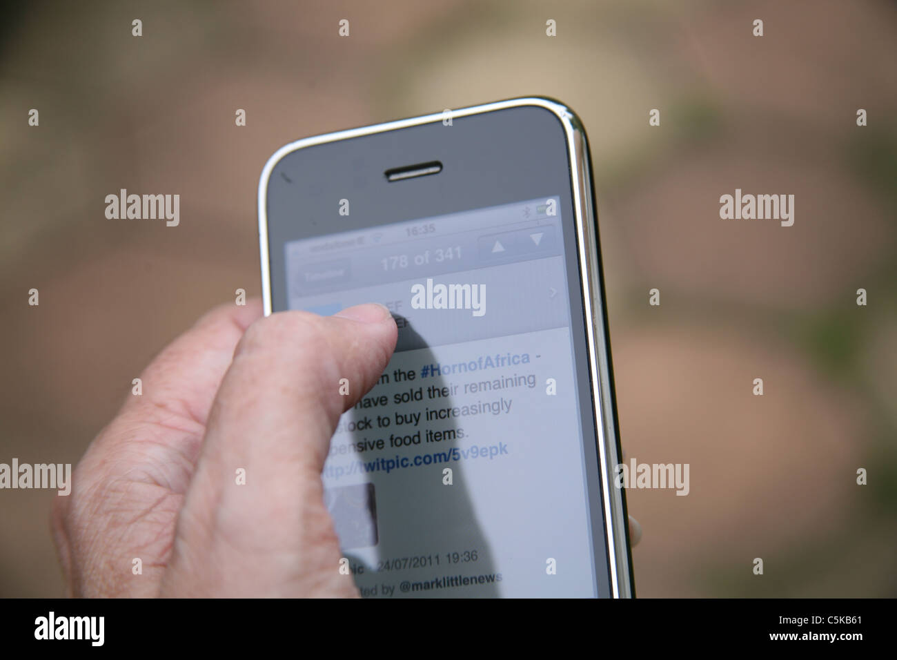 Person using twitter smartphone hi-res stock photography and images - Alamy