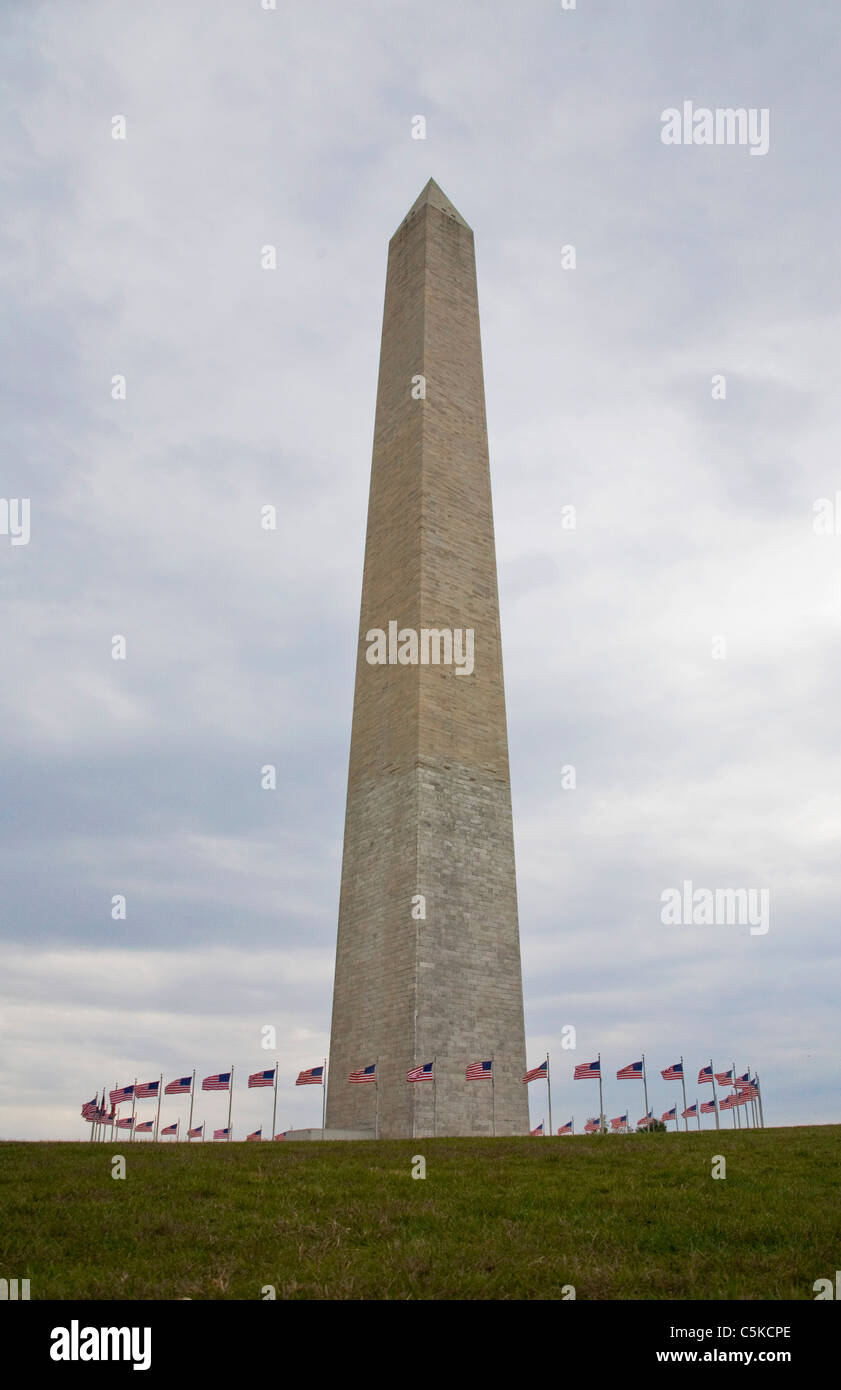 The Washington Monument with a circle of USA flags around its base ...