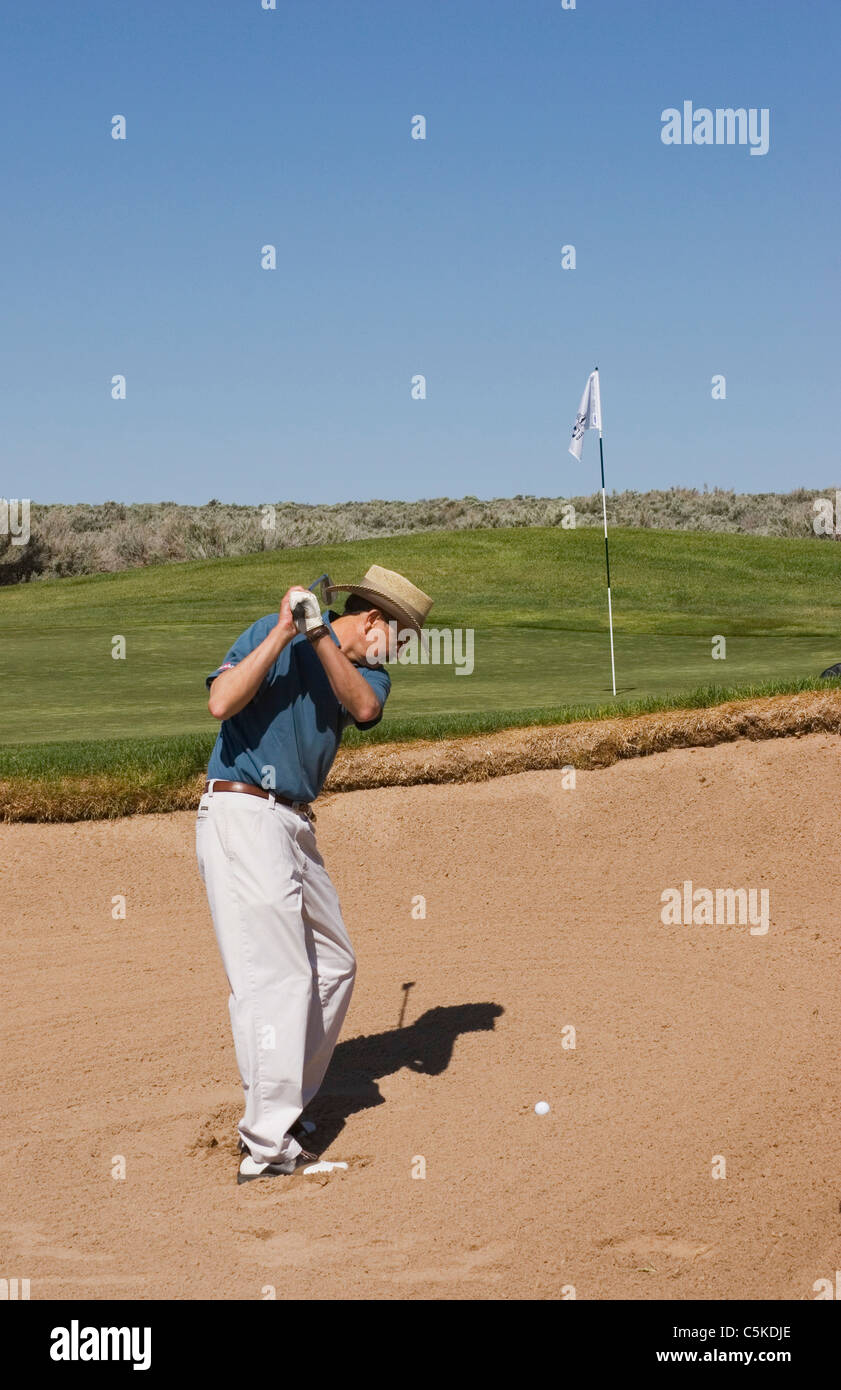 Vertical of golfer in sand trap Stock Photo - Alamy