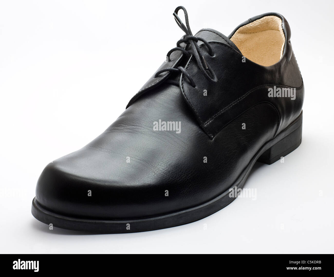 Black leather shoe on with background Stock Photo - Alamy