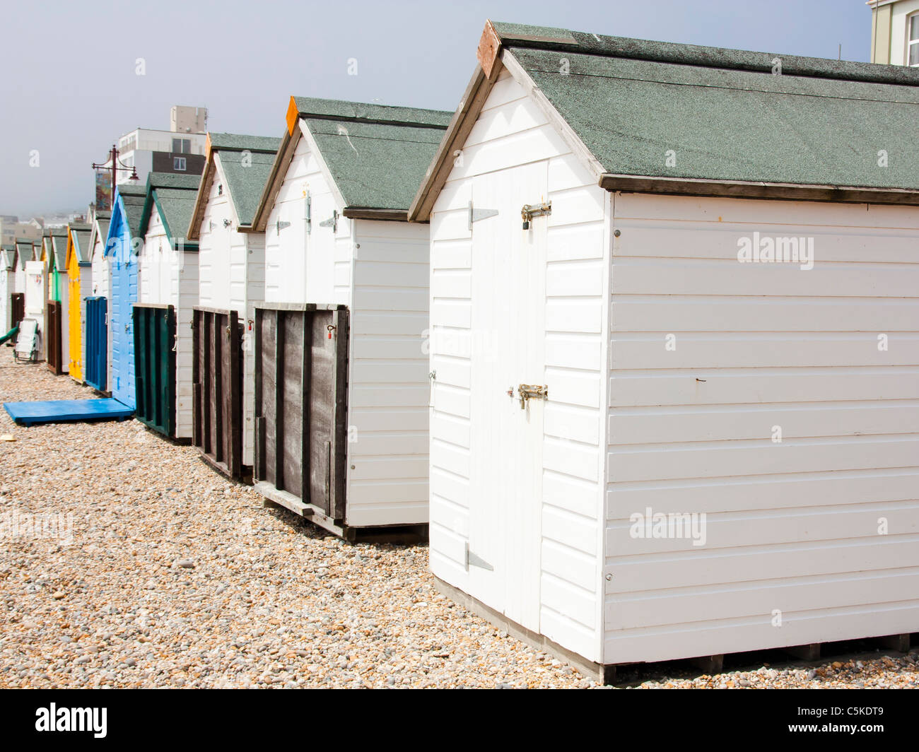 English beach huts on the sea front at Seaton Devon Stock Photo - Alamy