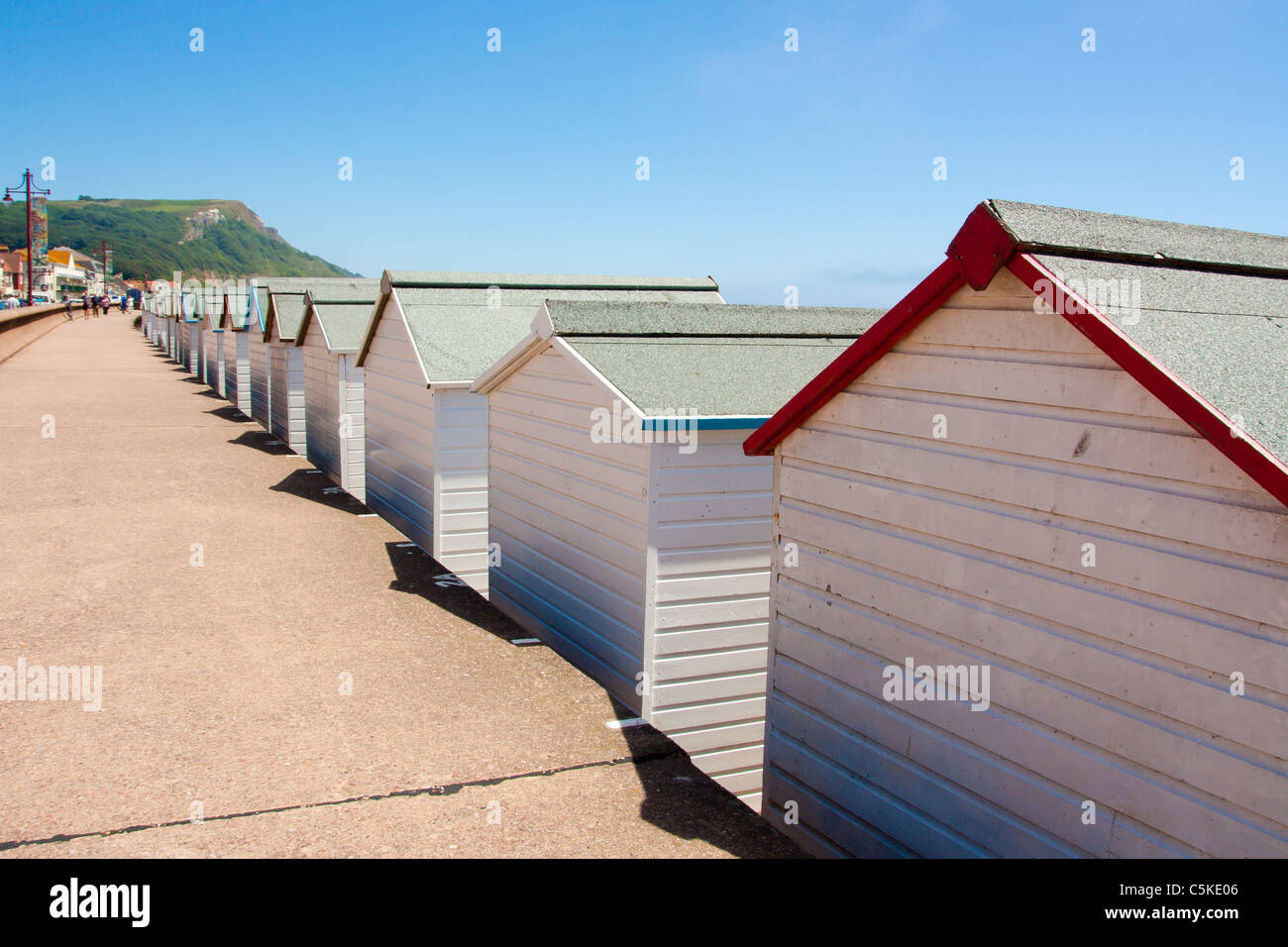 English beach huts on the sea front at Seaton Devon Stock Photo - Alamy