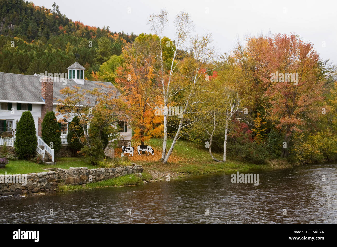 Traditional house on river in Fall Stock Photo - Alamy