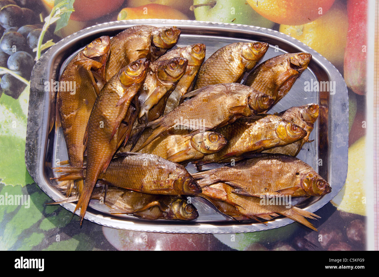 Metal tray loaded with freshly bloated fish Stock Photo - Alamy