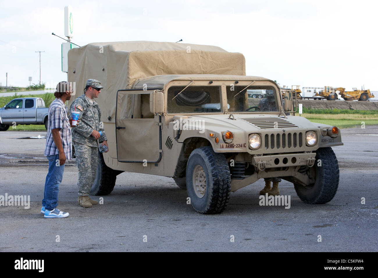local man talks to Iowa army national guard soldiers at humvee united ...
