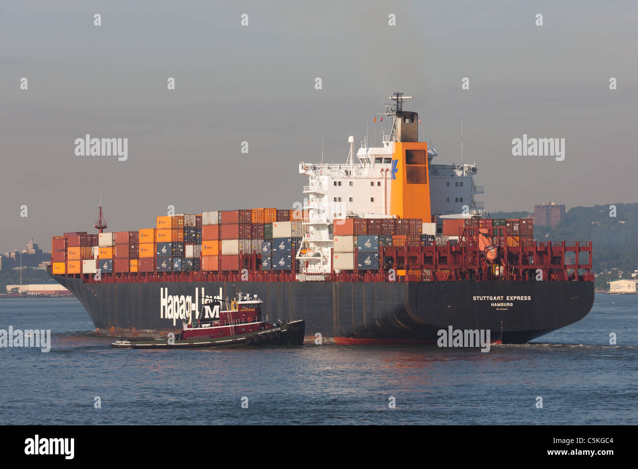 Container ship Stuttgart Express moves through New York Harbor assisted ...