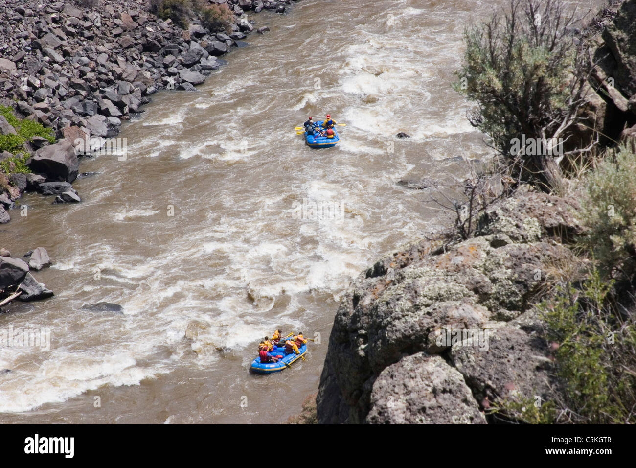 Medium view from above of two rafts on the Rio Grande River Stock Photo ...