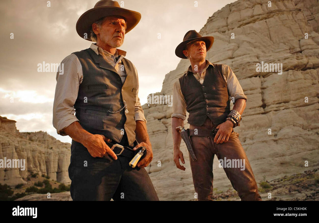 COWBOYS AND ALIENS 2011 Universal film with Harrison Ford at left and ...