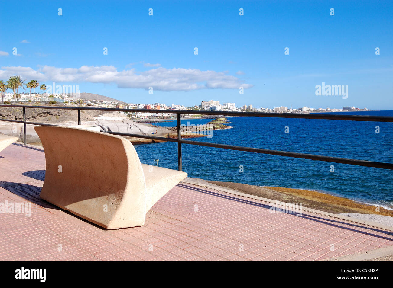 Seafront and bench at Playa de las Américas, Tenerife island, Spain ...