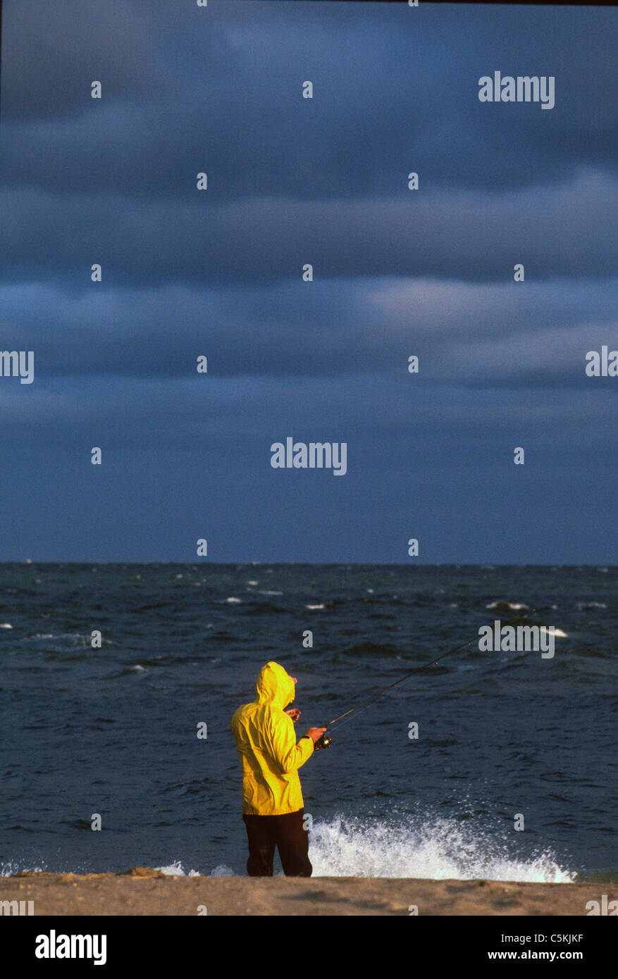 Yellow slicker fishing Wasque Point, Chapaquiddick, MA Stock Photo - Alamy