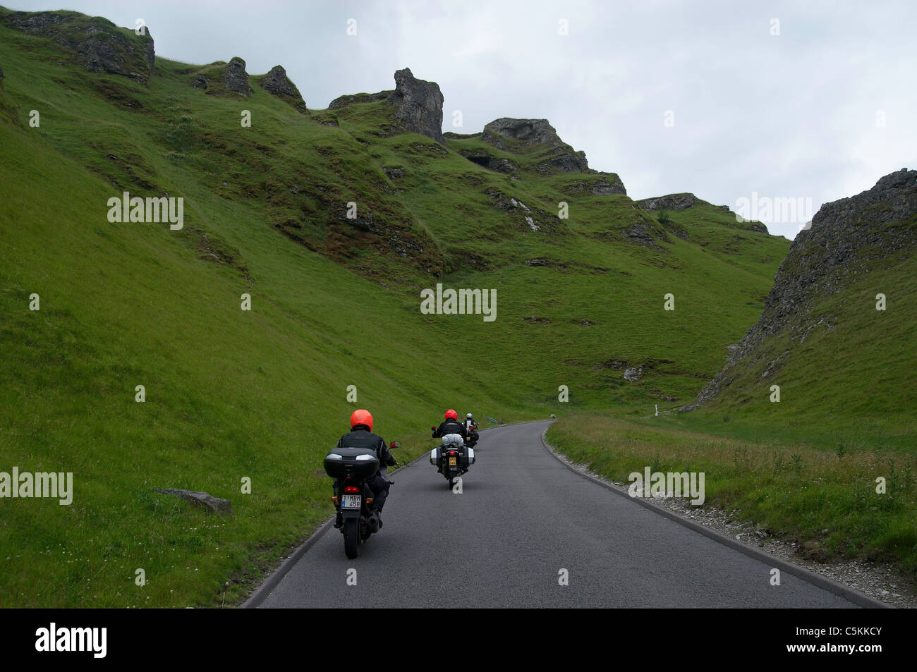 Group of three friends motorcycling through Wales Stock Photo - Alamy
