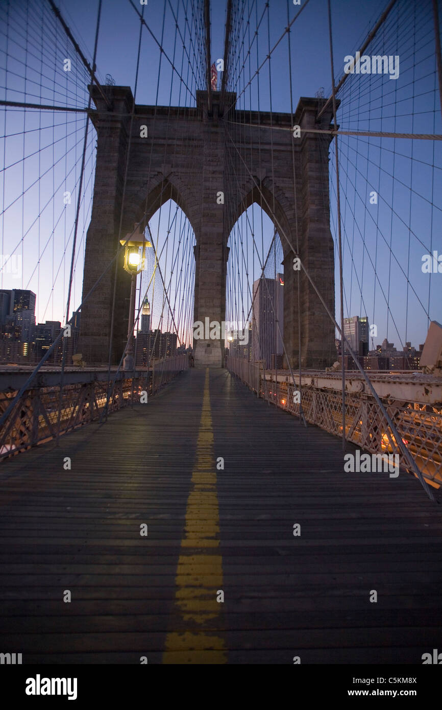 Brooklyn Bridge with lamp post in foreground, at sunset looking from ...
