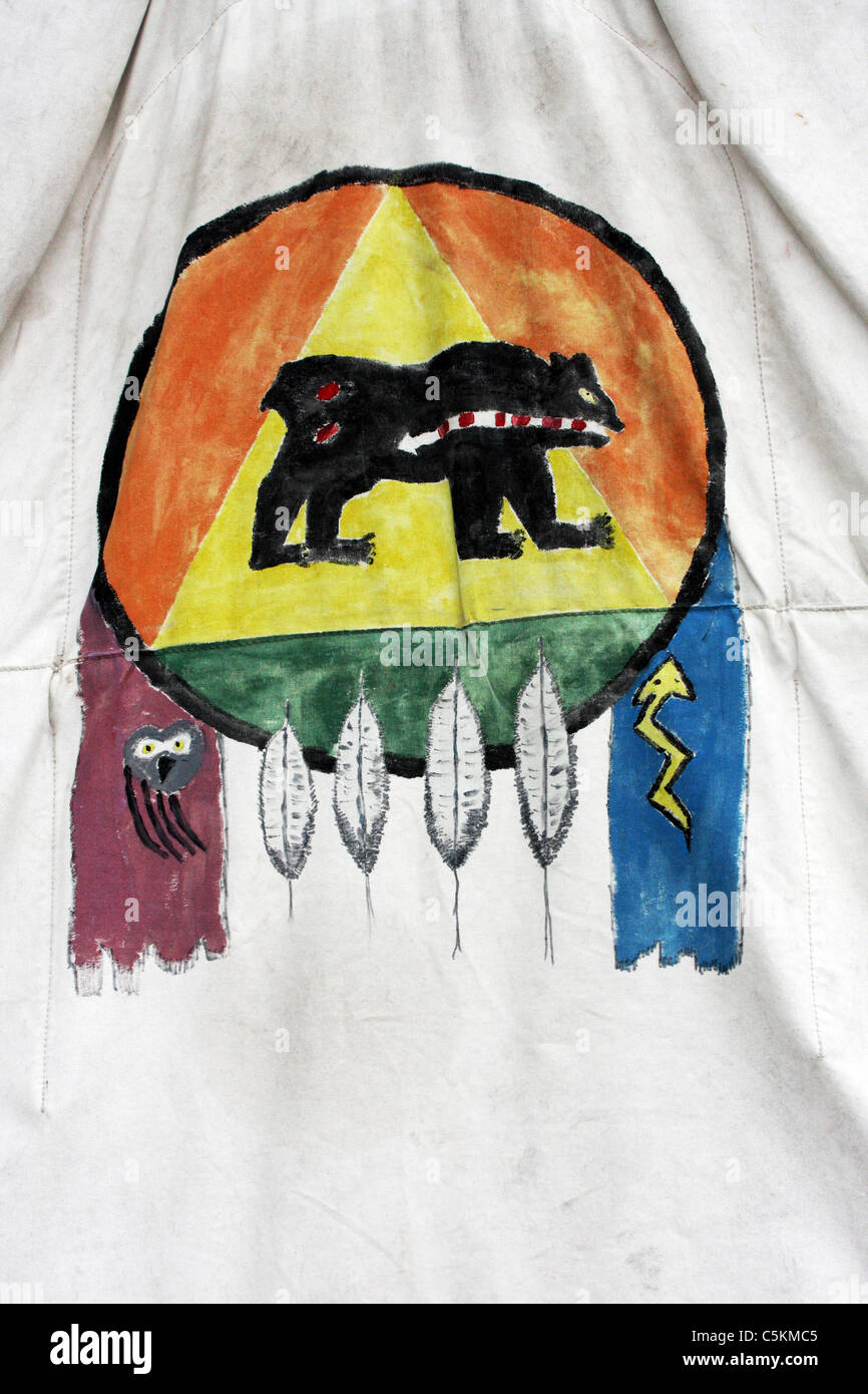 A painted symbol of a bear on the canvas of a Native American Indian ...