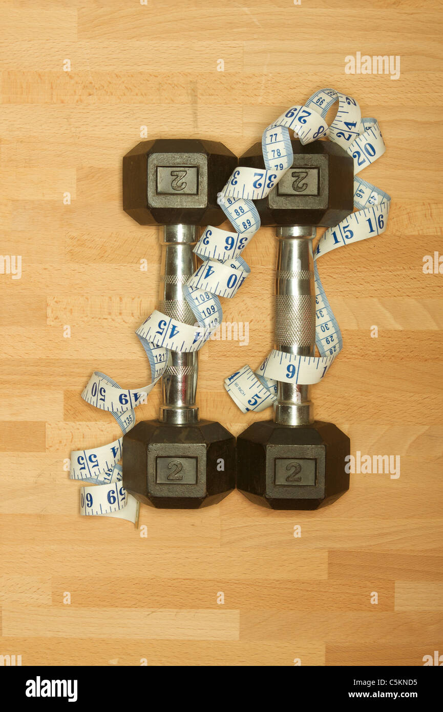 Gym weights on the floor at a gym Stock Photo - Alamy