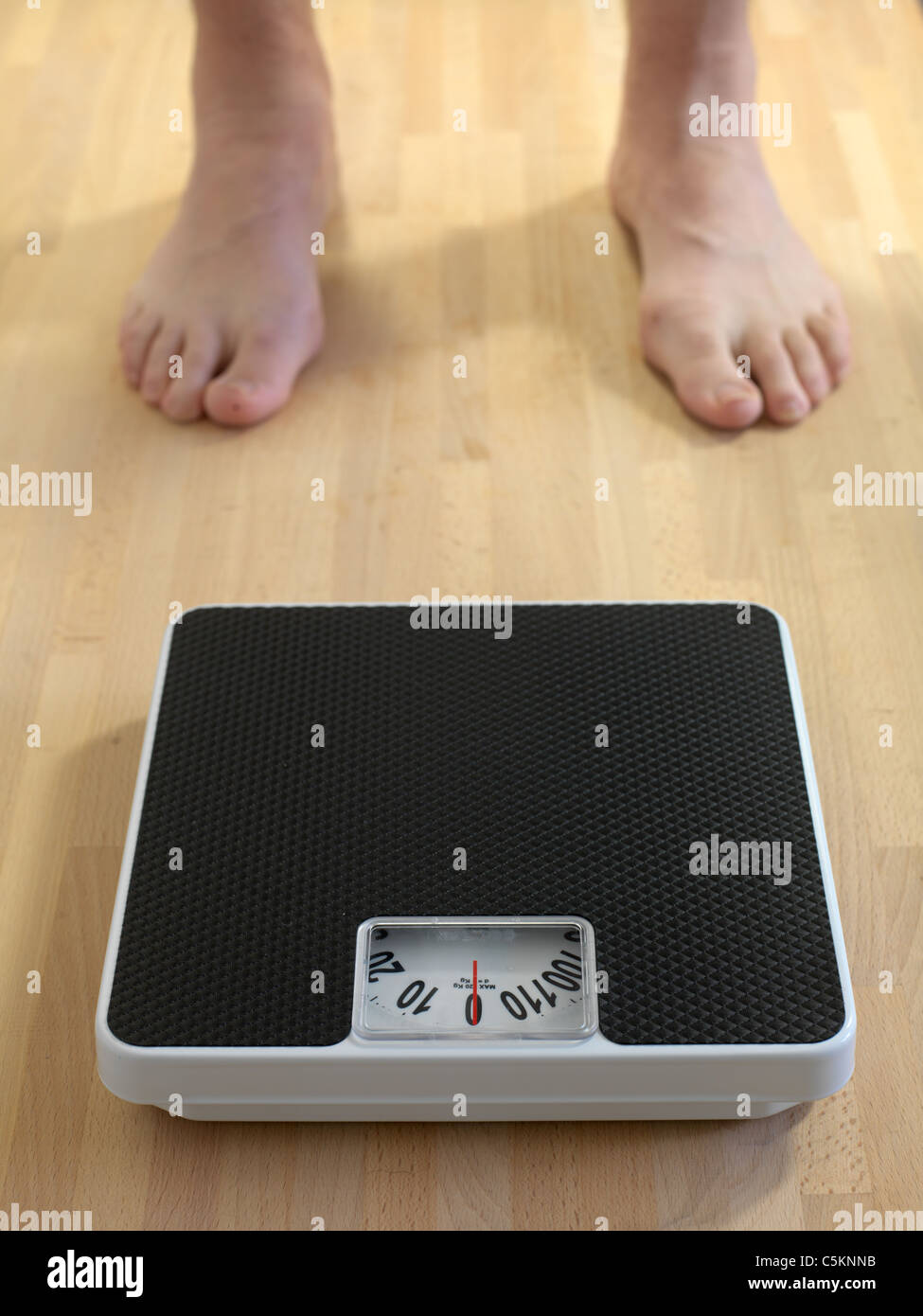 Bathroom scales isolated against a white background Stock Photo - Alamy