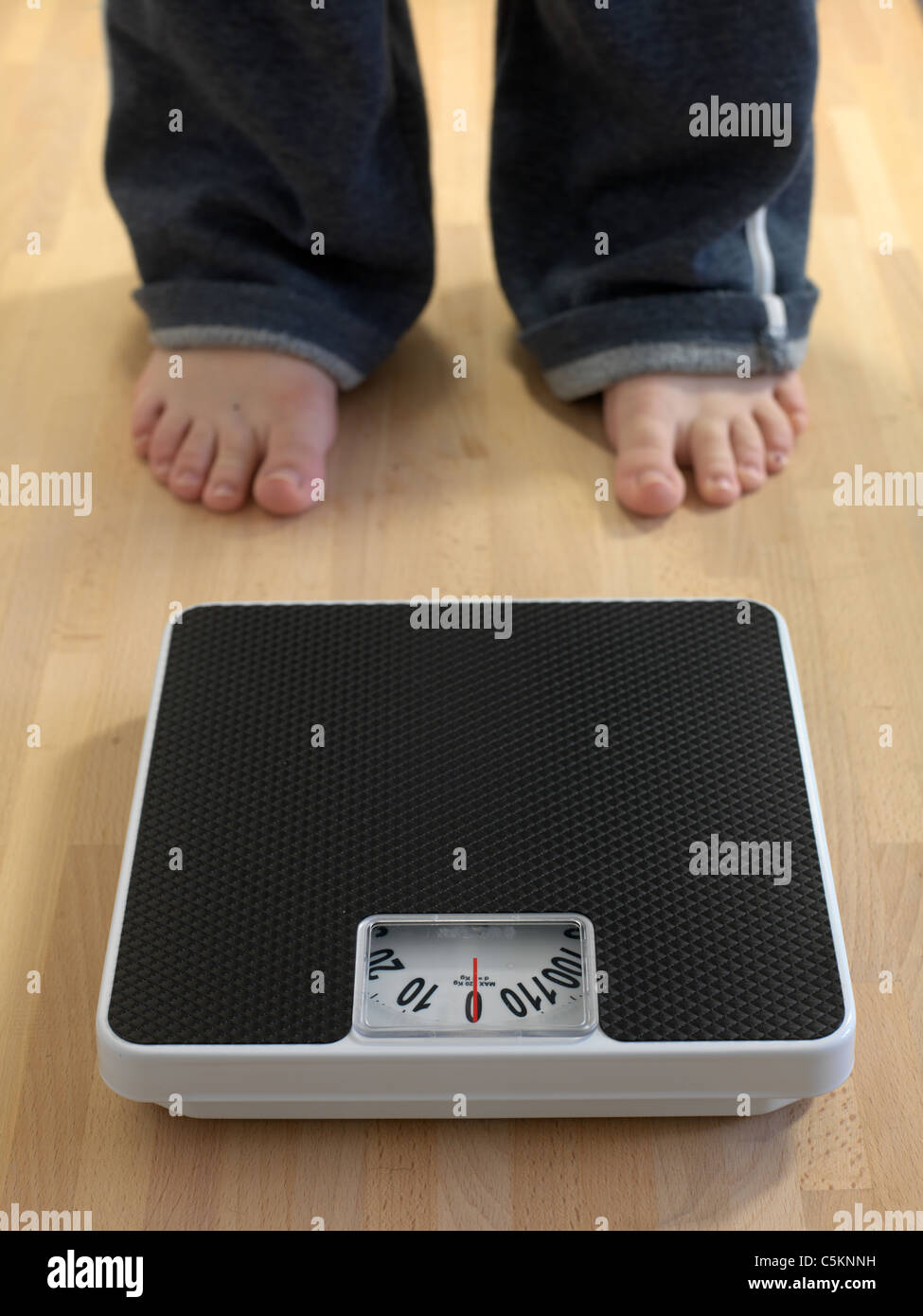 Bathroom scales isolated against a white background Stock Photo - Alamy