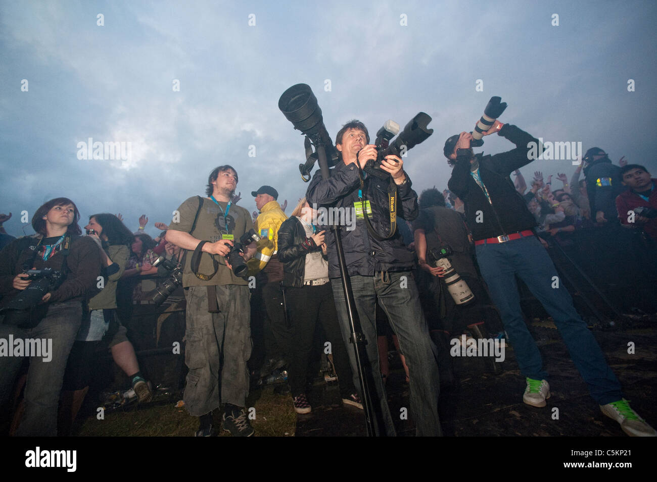 Photographers in the pit during large music festival Stock Photo - Alamy