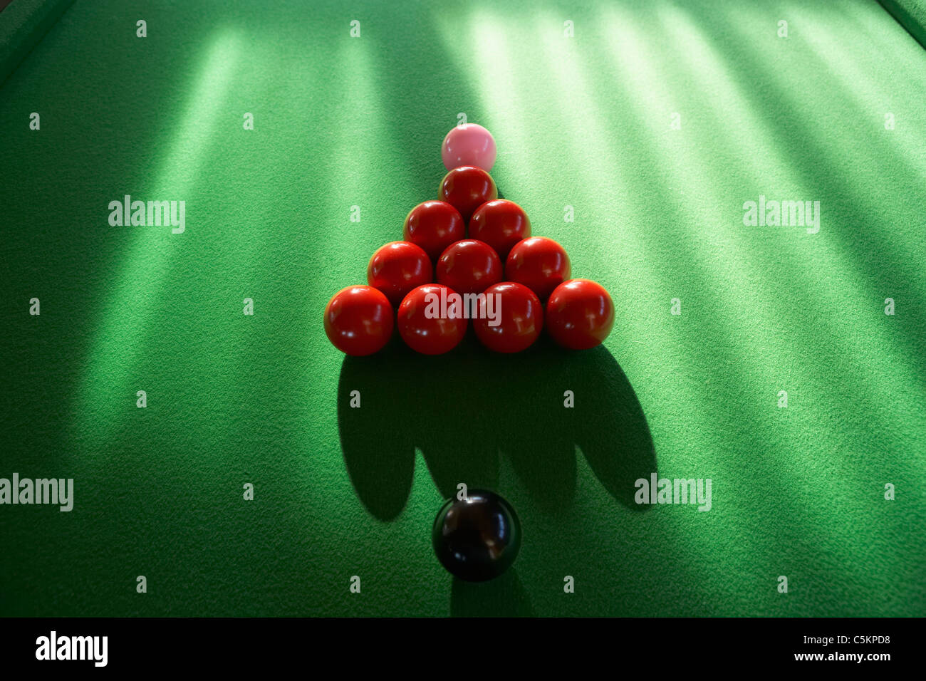 Close-up of a small snooker table, or pool table, with triangle of ten ...