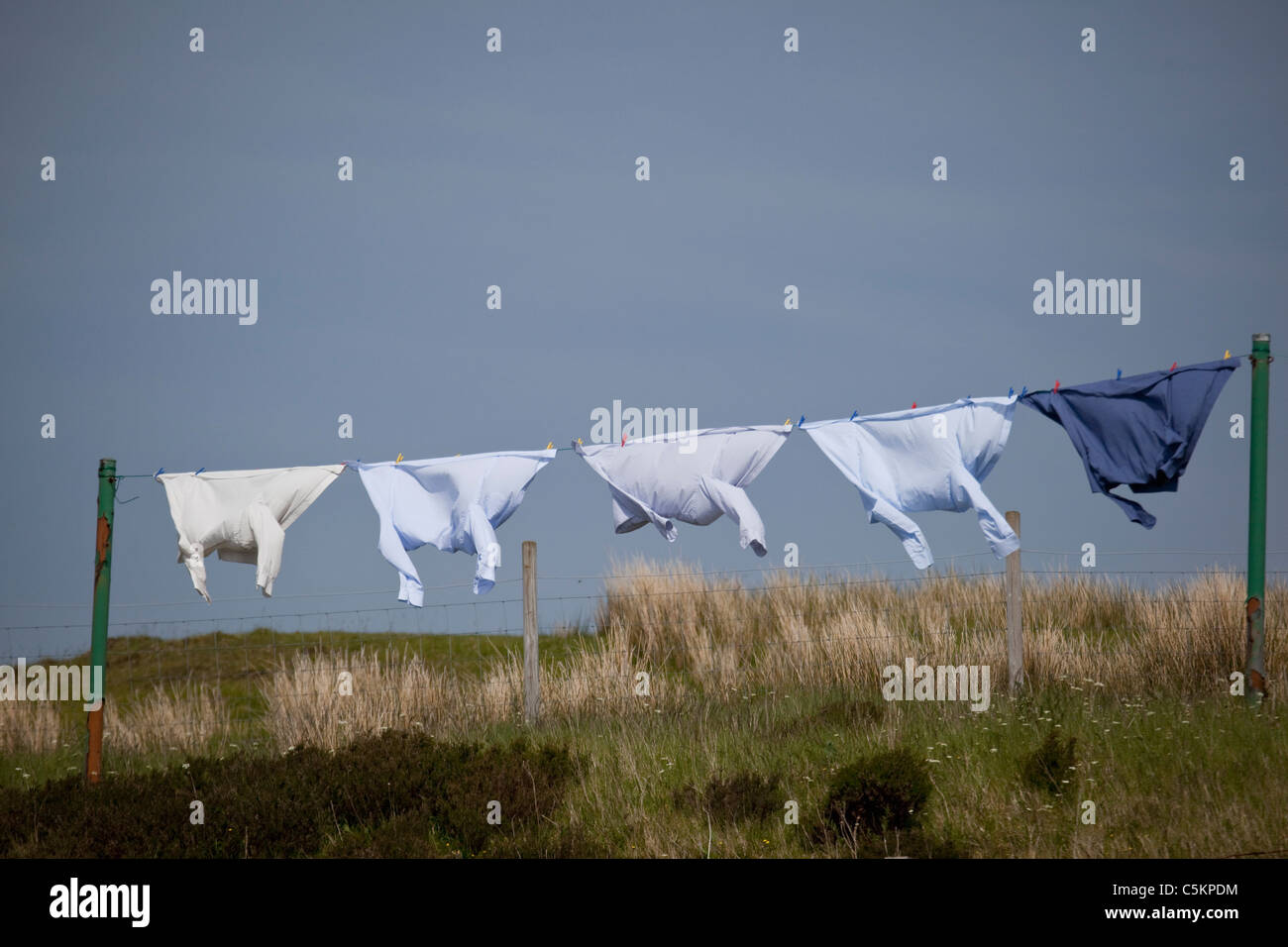 Clothes drying in the wind on a clothes line hi-res stock photography ...