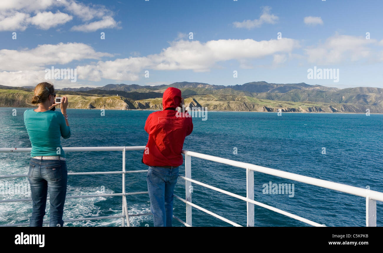 Two passengers (back view) on an inter-island ferry in Cook Strait ...