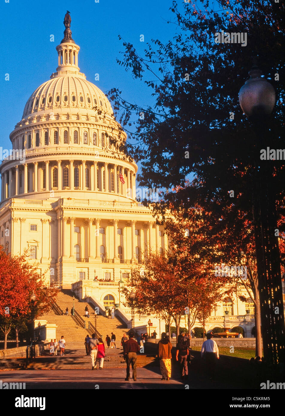 The Capitol building at sunset on a beautiful spring day, with tourist ...