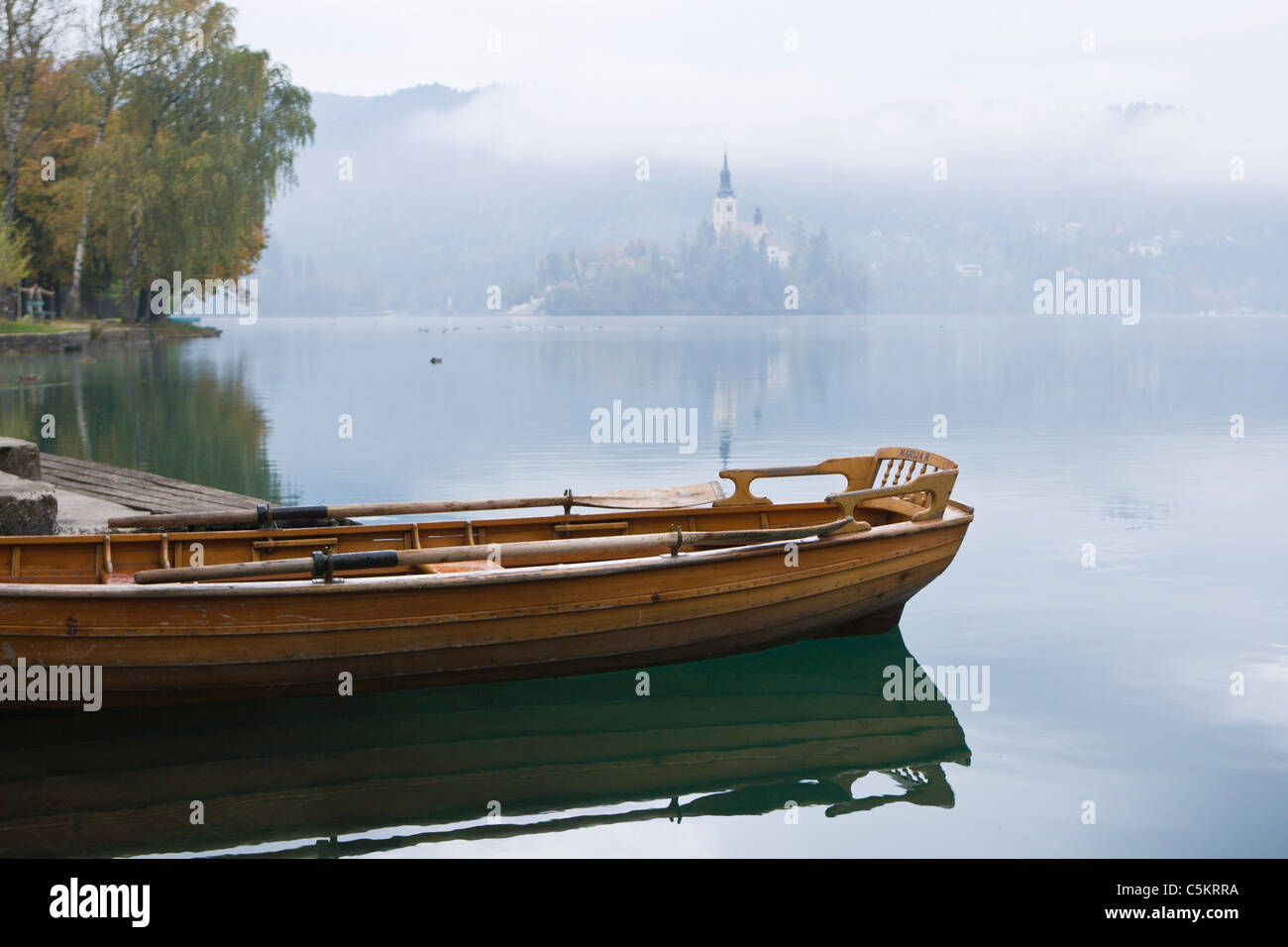 Colorful row boats for touring Lake Bled and beautiful fall colors ...