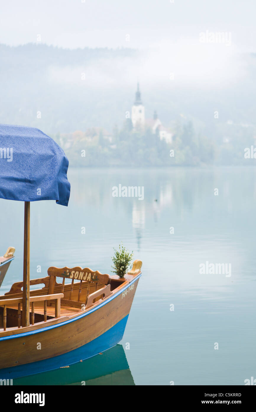 Colorful row boats for touring Lake Bled and beautiful fall colors ...
