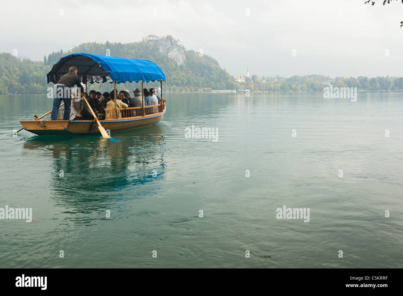 Colorful row boats for touring Lake Bled and beautiful fall colors ...