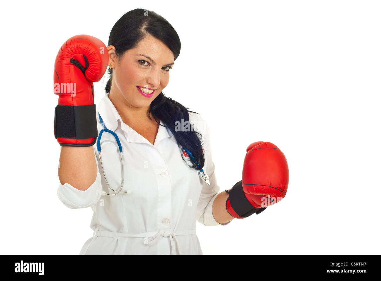 Happy doctor woman wearing boxing gloves isolated on white background ...
