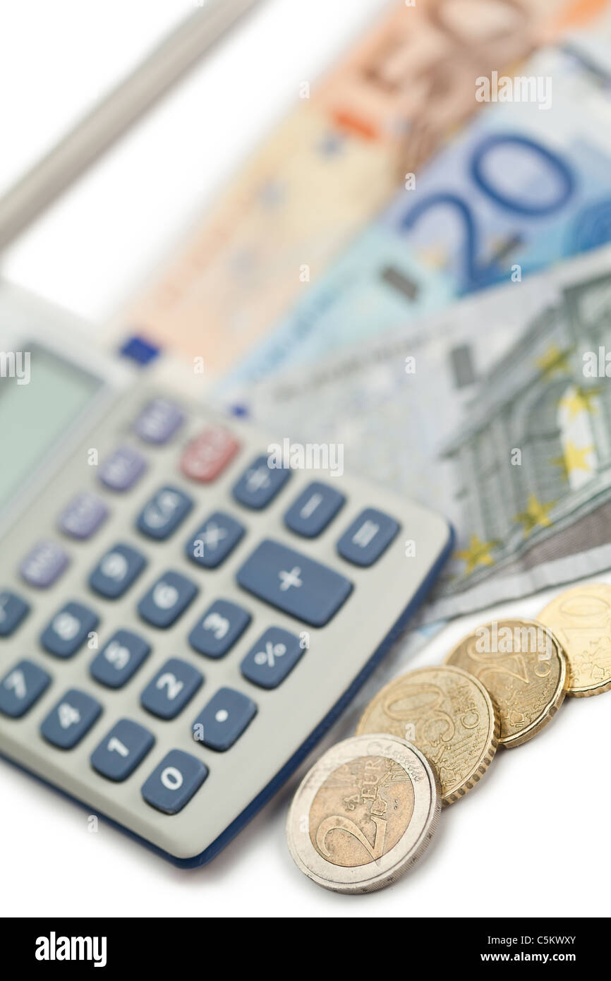 Cash and coins witch pocket calculator Stock Photo - Alamy