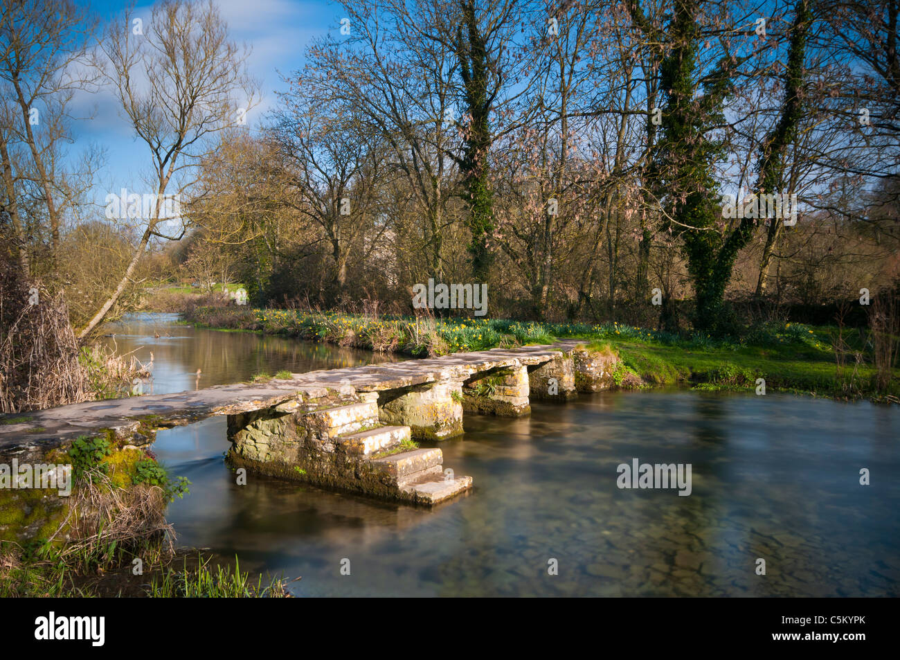 River Leach and ancient stone bridge, Eastleach, Gloucestershire ...