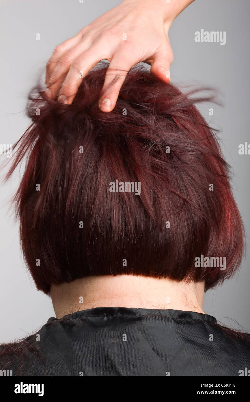 Hairdresser ruffling clients hair Stock Photo - Alamy