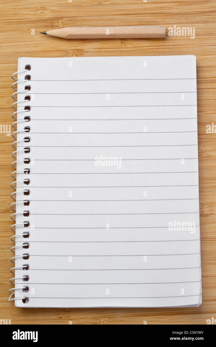 Notebook and pencil Stock Photo - Alamy