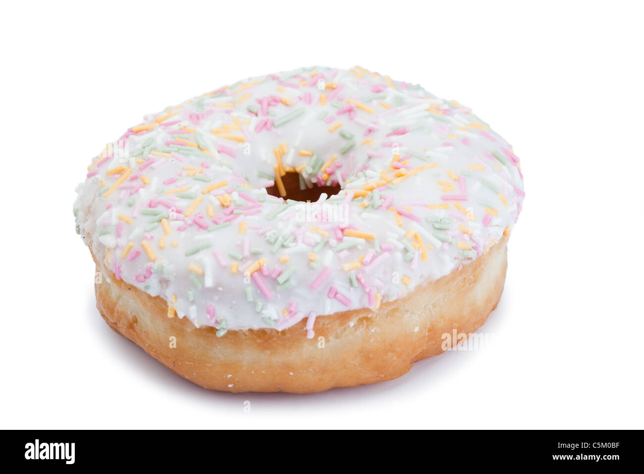 Pink iced doughnut covered in sprinkles isolated Stock Photo - Alamy