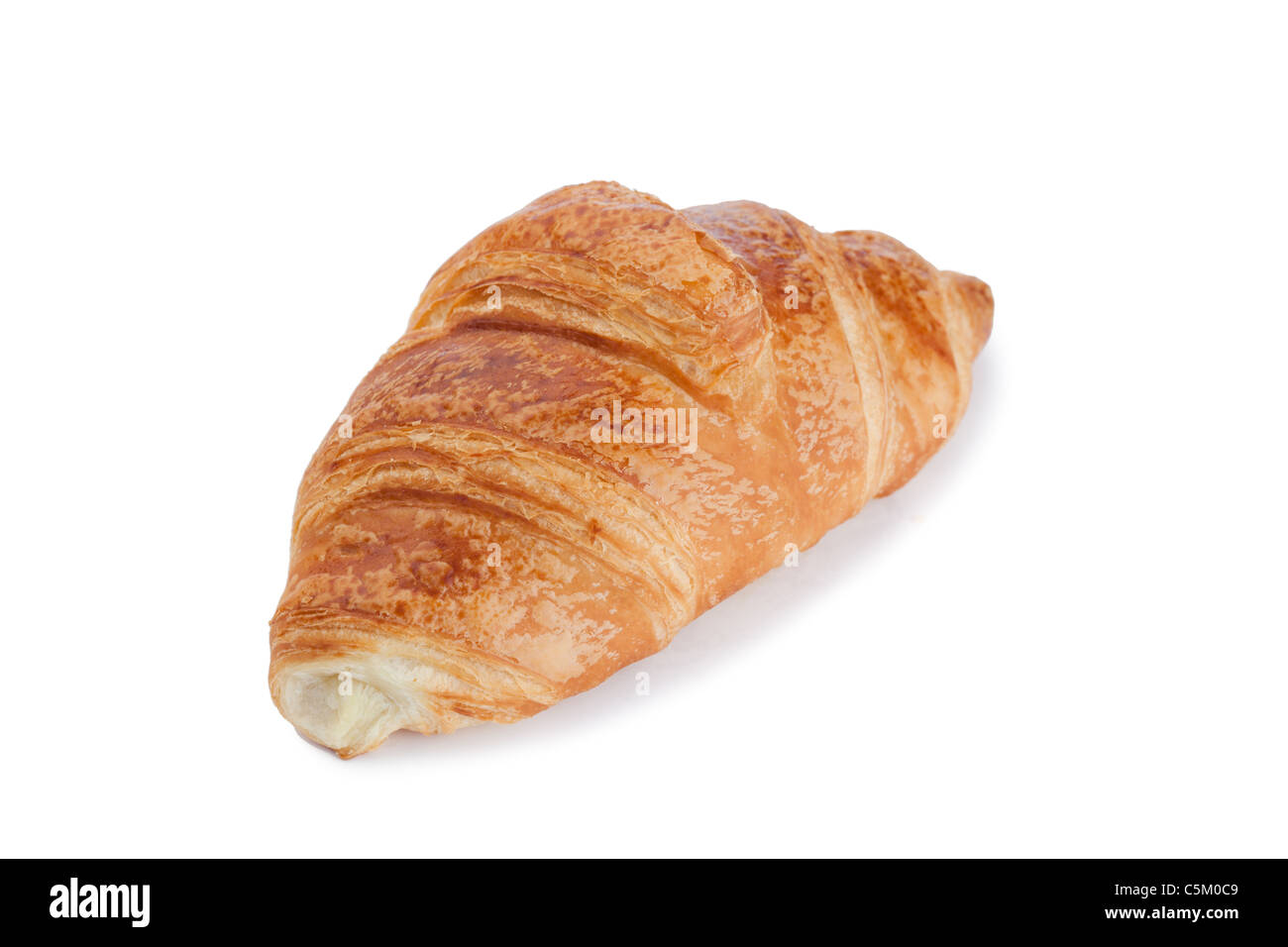 Golden croissant isolated Stock Photo - Alamy