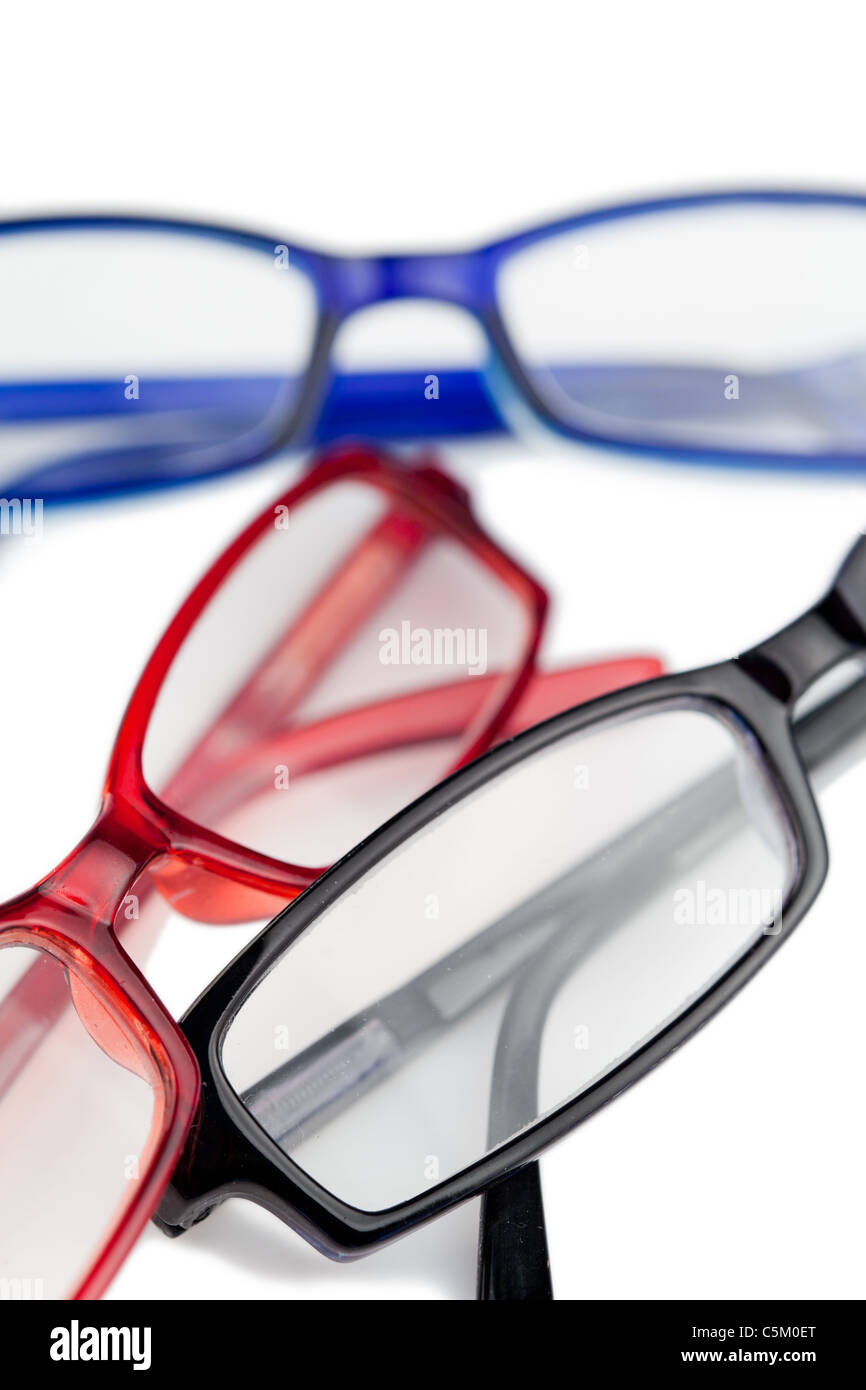 Three pairs of glasses with blue red and black frames Stock Photo - Alamy