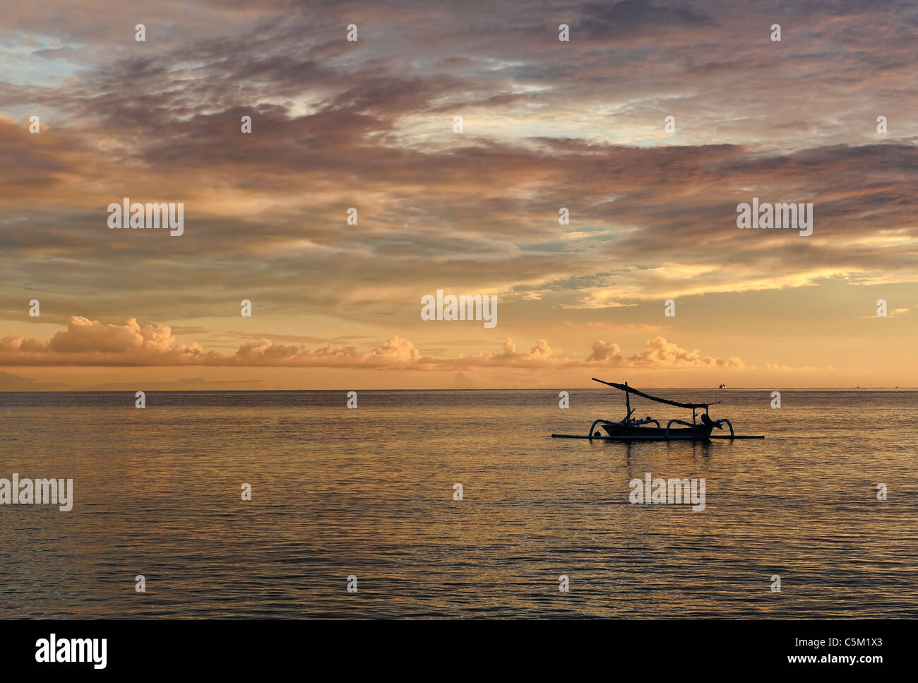 traditional indonesian boat (jukung) at sunrise Stock Photo - Alamy